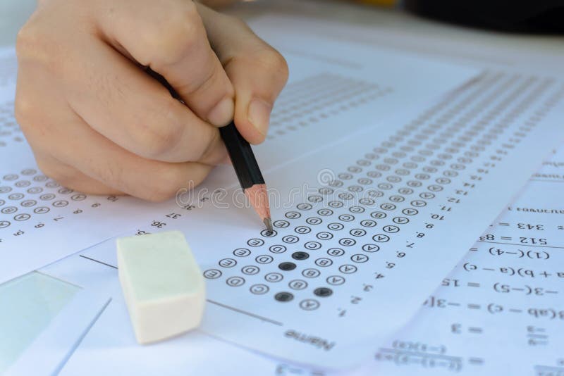 Students Hand Holding Pencil Writing Selected Choice on Answer Sheets ...