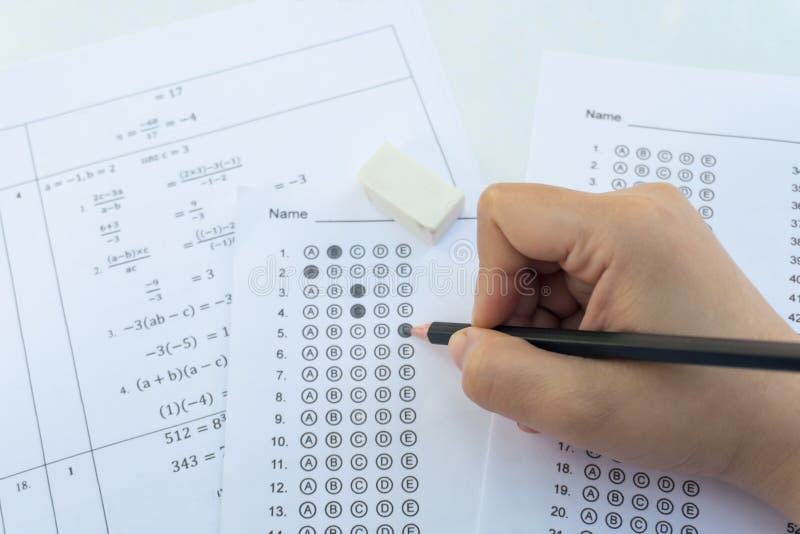 Students Hand Holding Pencil Writing Selected Choice on Answer Sheets ...