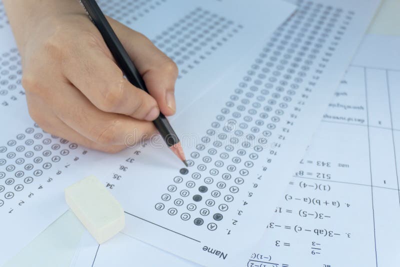 Students Hand Holding Pencil Writing Selected Choice on Answer S Stock ...