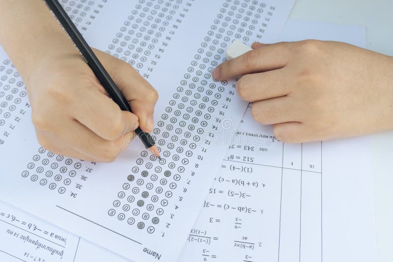 Students Hand Holding Pencil Writing Selected Choice on Answer Sheets ...