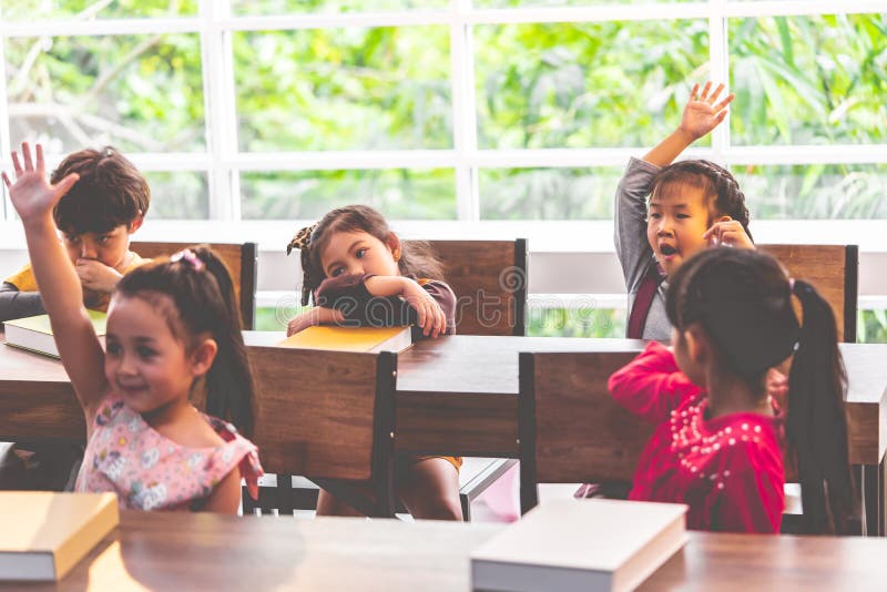 Students Hand Up for Question in Classroom Stock Photo - Image of girl ...