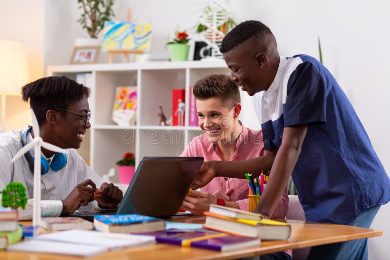 Students Having Good Mood Using Laptop and Having Brainstorming Stock ...