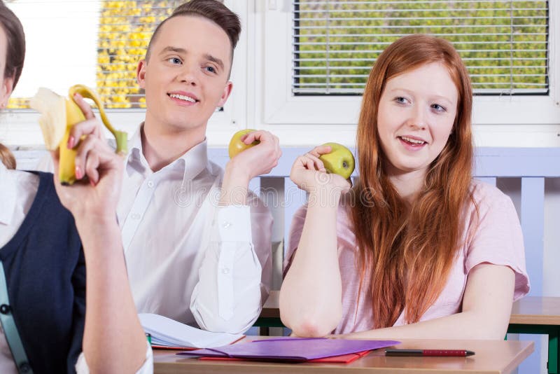 Students having lunch time stock photo. Image of banana - 43072962