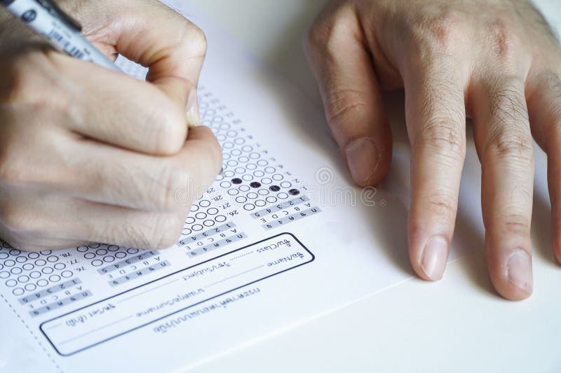 Students Hold a Pencil and Write Their Choice on the Answer Sheet and ...