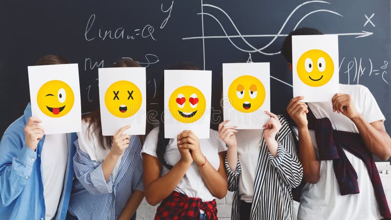 Students Holding Papers with Emotions Over Chalkboard Stock Photo ...