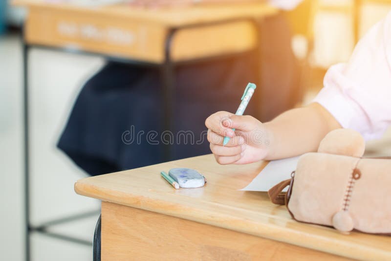 Students Holding Pen in Hands Taking Exams, Writing Examination Room ...