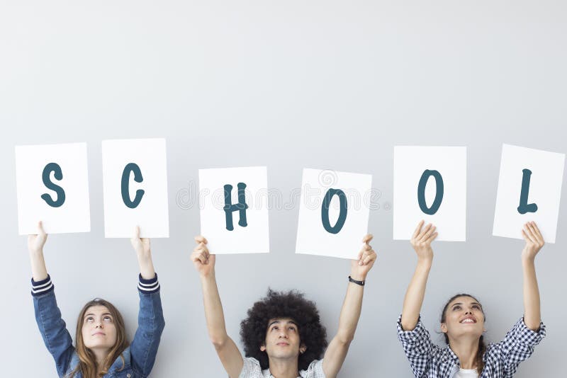 Students Holding School Written Banner Stock Photo - Image of cardboard ...