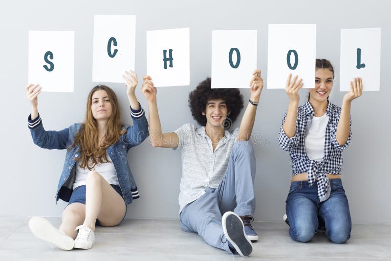 Students Holding School Written Banner Stock Photo - Image of high ...