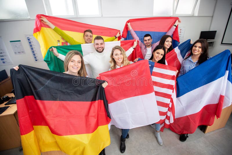 Students Holding Various Flags of Different Countries in the Classroom ...