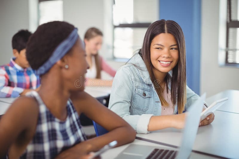 Schoolboy Interacting with Classmate in Library Stock Photo - Image of ...