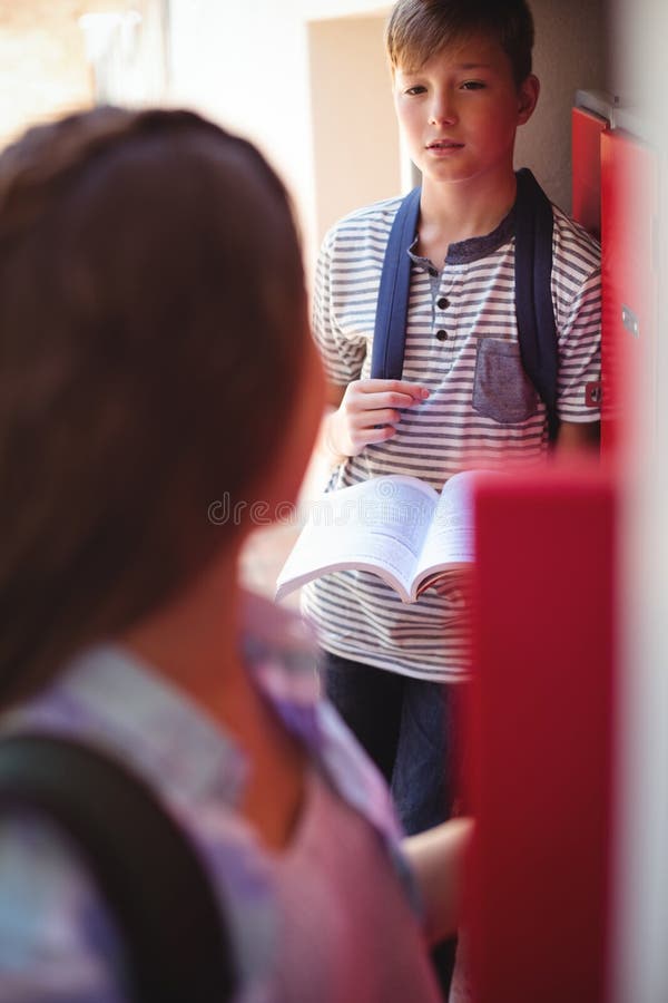 Students Interacting with Each Other in Locker Room Stock Image - Image ...