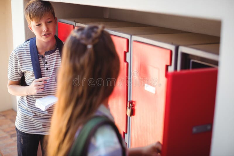 Students Interacting with Each Other in Locker Room Stock Photo - Image ...