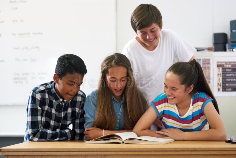 Students, Kids and Study with Textbook in Classroom at School for ...