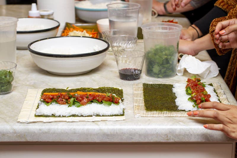 Students Learning To Make Sushi Rolls in a Class Stock Image - Image of ...