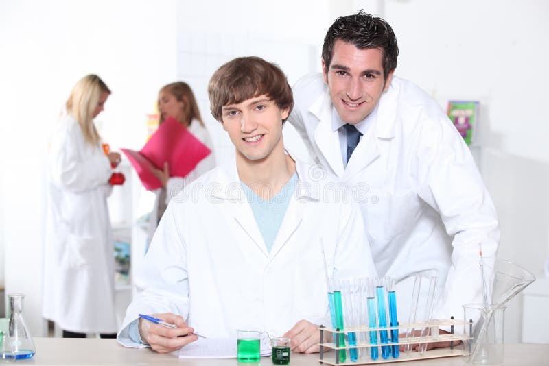 Smiling researchers in lab stock photo. Image of chemistry - 31258536