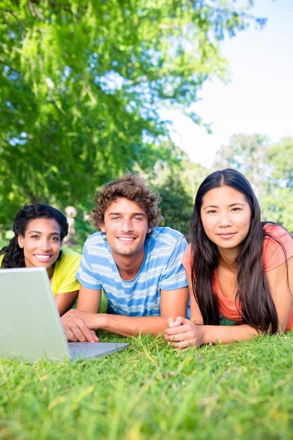 Students with Laptop Lying on Campus Stock Image - Image of male ...