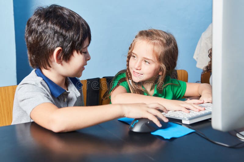 Students Learn at the Computer in Elementary School Stock Image - Image ...