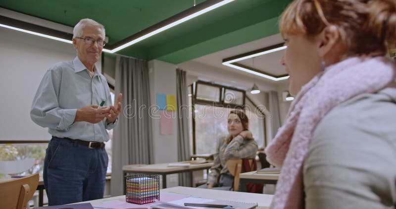 Professor Helping Students after Class Stock Footage - Video of ...