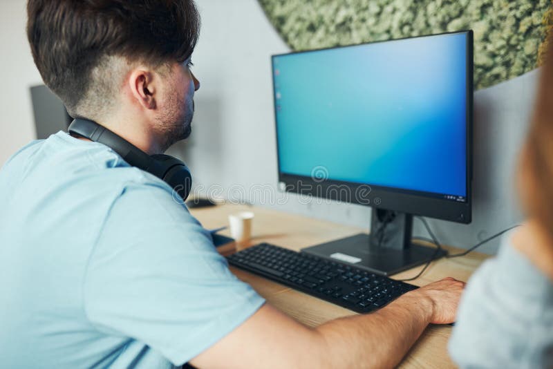 Students Learning in Computer Classroom. Young Man Preparing for Test ...
