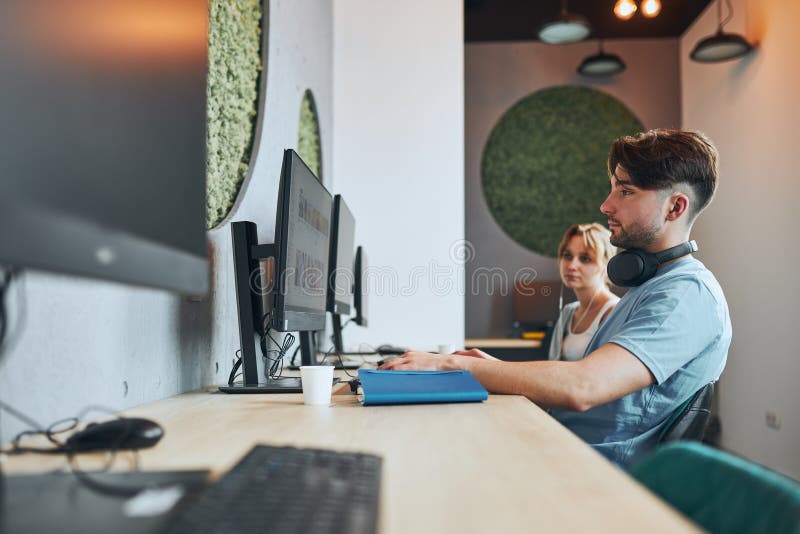 Students Learning in Computer Classroom. Young Man Preparing for Test ...