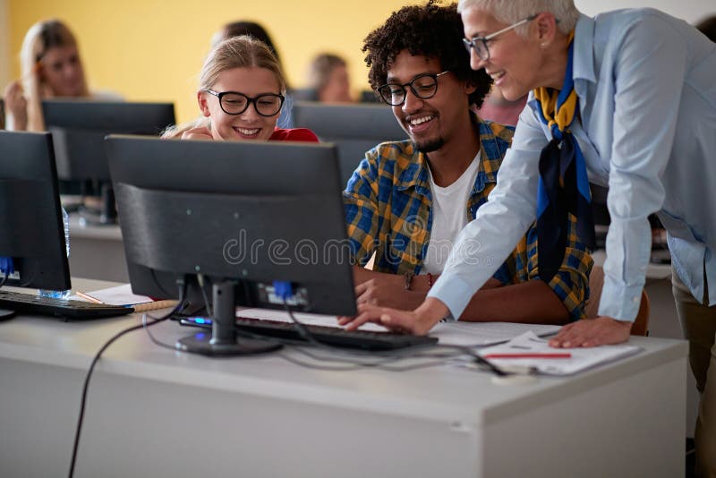 Students Learning from a Female Professor at an Informatics Lecture ...