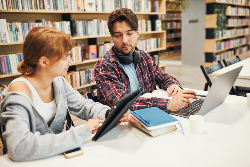 Students Learning in University Library. Young Man Preparing for Test ...