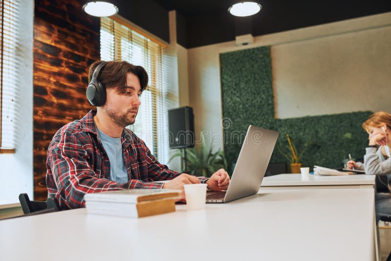Students Learning in University Library. Young Man Having Video Class ...