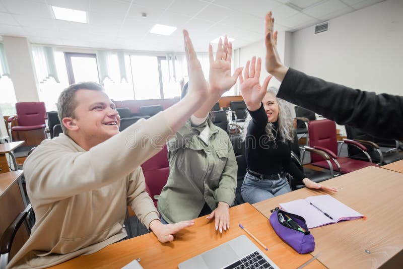 Students and Lecturer Give a High Five in the University Classroom ...