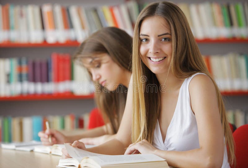 Students in a library stock image. Image of book, university - 25901347