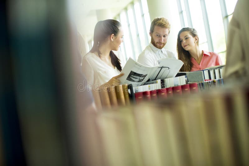 Students in the library stock photo. Image of bookshelf - 58614108