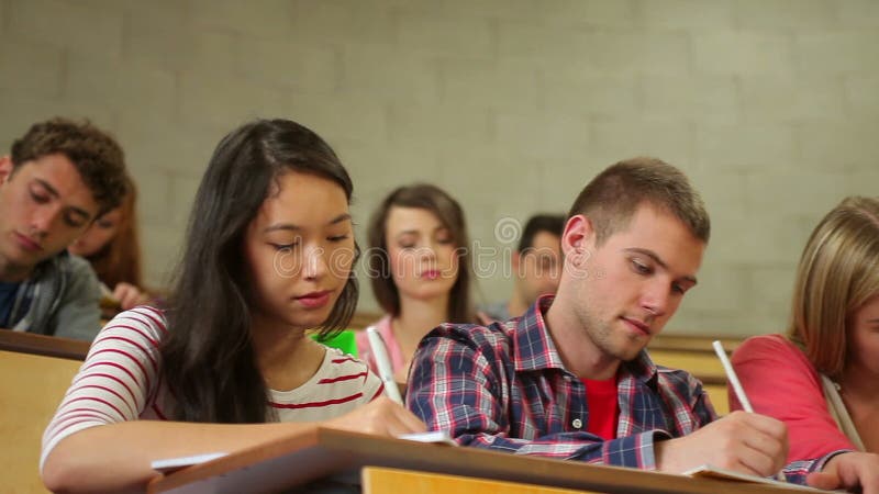 Students Listening Carefully in Lecture Hall and Taking Notes Stock ...