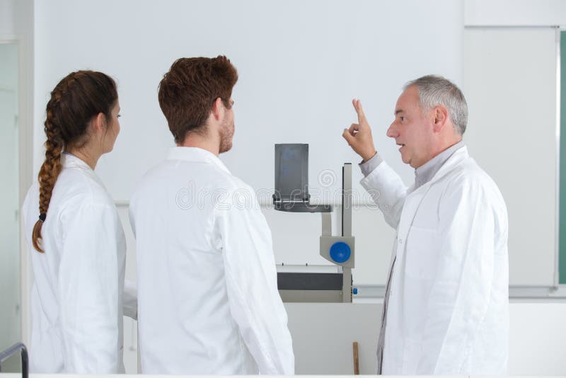 Students Listening Carefully To Their Teacher during Science Class ...