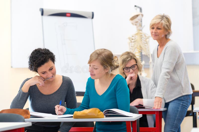 Students Listening To Teacher at Lesson Stock Image - Image of exam ...
