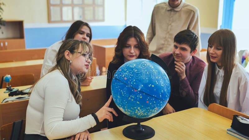 Students Look at a Globe of the Starry Sky in a Classroom at School ...