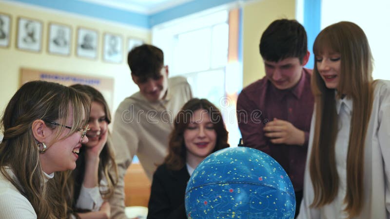 Students Look at a Globe of the Starry Sky in a Classroom at School ...
