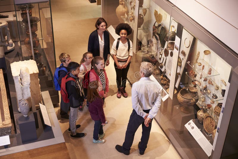 Students Looking at Artifacts in Case on Trip To Museum Editorial Photo ...