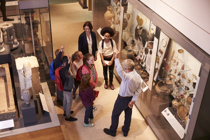 Students Looking at Artifacts in Case on Trip To Museum Editorial Image ...