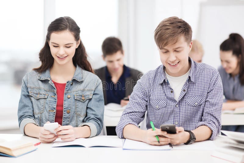 Students Looking into Smartphone at School Stock Image - Image of ...
