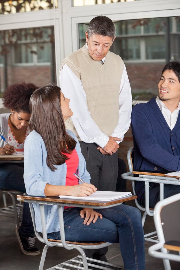 Students Looking at Teacher while Giving Exam in Stock Image - Image of ...