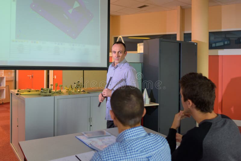 Students Looking at Teacher and Projector Screen Stock Photo - Image of ...