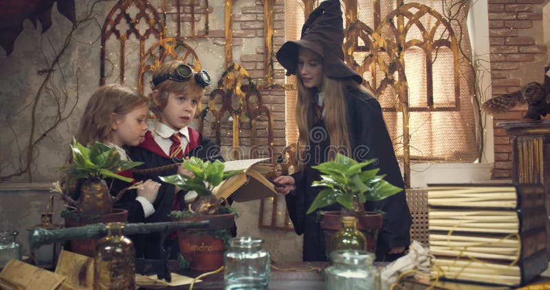 Students of a Magic School are Making Note in a Book, Wizard Teacher ...