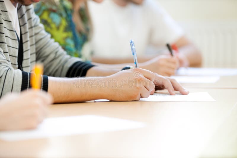 Student Studying and Writing Notes in Public or School Library Stock ...