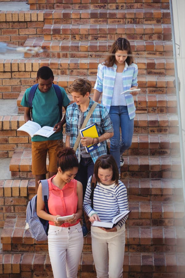 Students Moving Down Staircase Stock Photo - Image of confidence ...