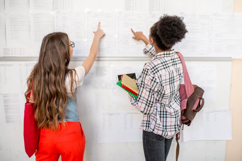 Students Near the Lesson Schedule at the University Stock Image - Image ...