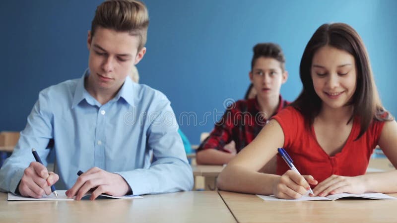 Students with Notebooks Writing Test at School Stock Video - Video of ...