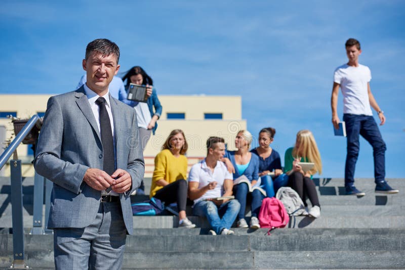 Students Outside Sitting on Steps Stock Photo - Image of outdoors ...