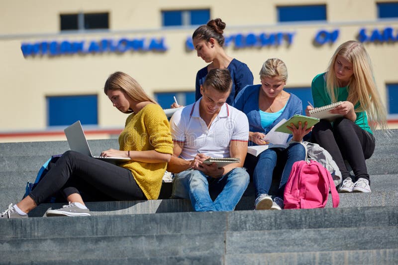 Students Outside Sitting on Steps Stock Photo - Image of laptop, happy ...