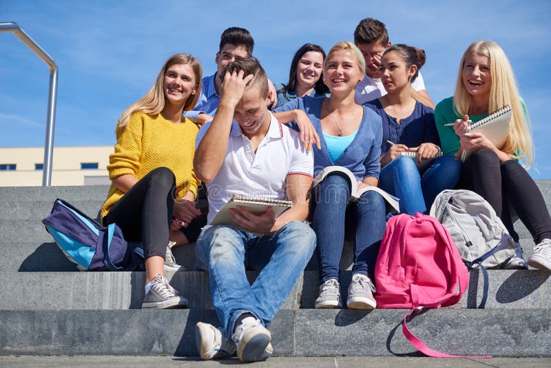 Students Outside Sitting on Steps Stock Image - Image of face, happy ...