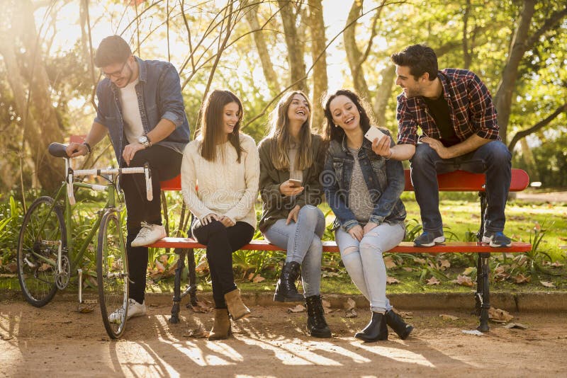 Students in the park stock photo. Image of happiness - 191633598