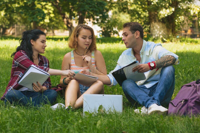 Students in the park stock photo. Image of studying - 127717468